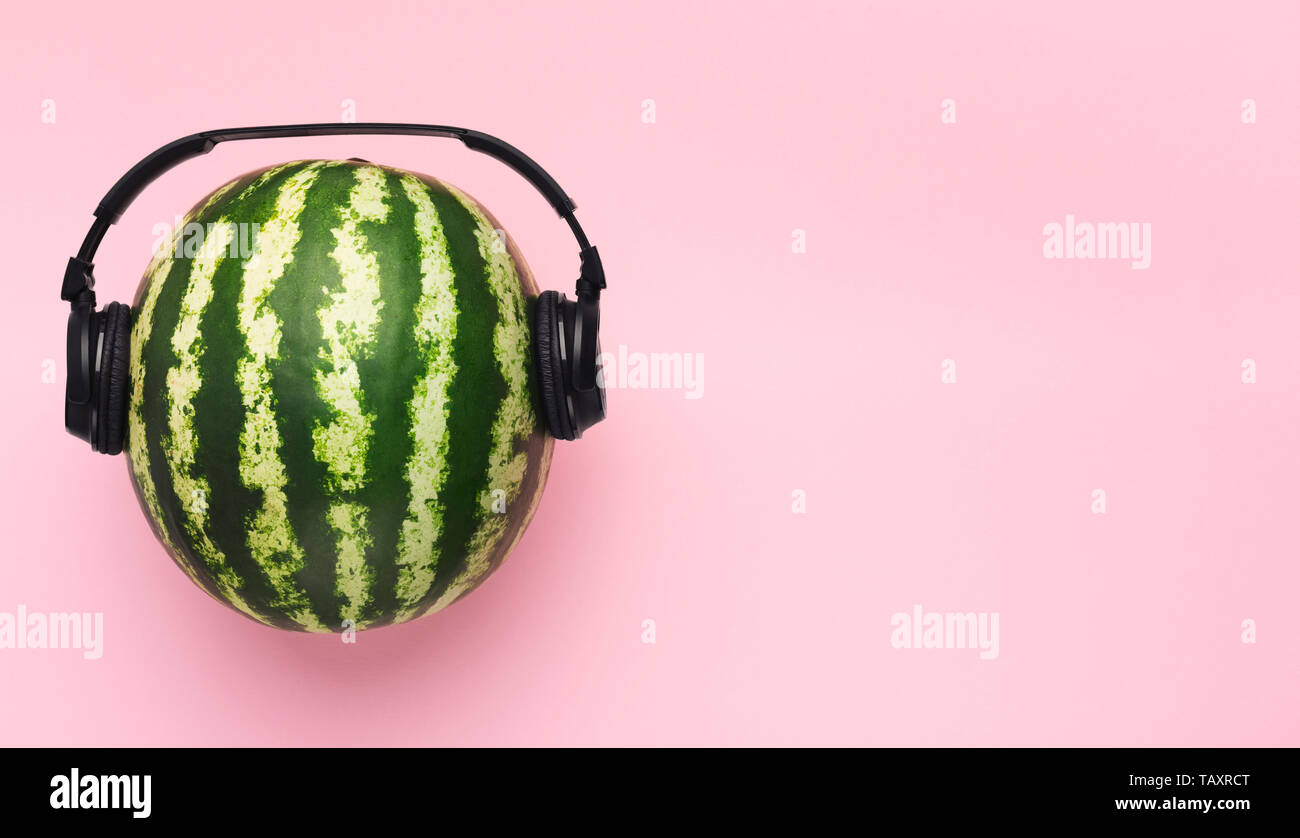Summer music with tropical sounding mood, watermelon in headphones ...