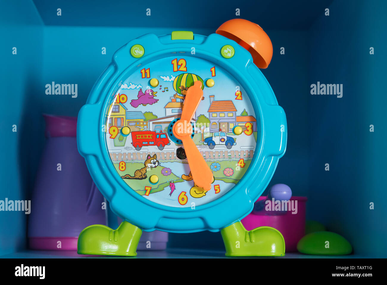 Colorful plastic toy clock in textured foam for kid to learn about the ...