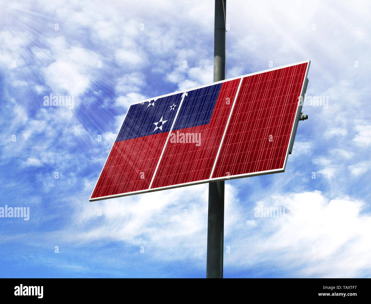 Solar panels against a blue sky with a picture of the flag of Samoa ...