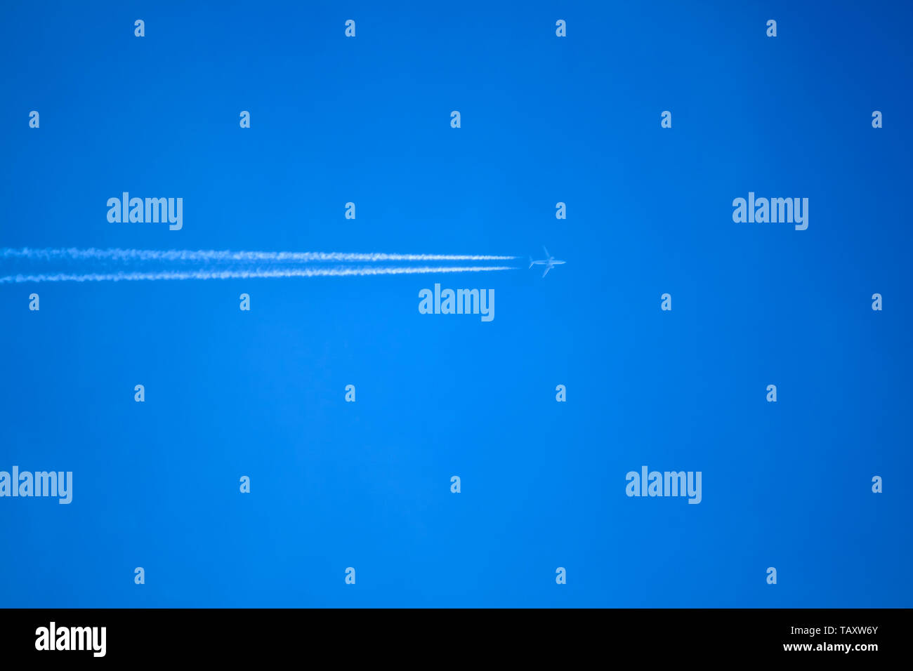 Trail of jet plane on clear blue sky. Airplane in the sky with contrail ...