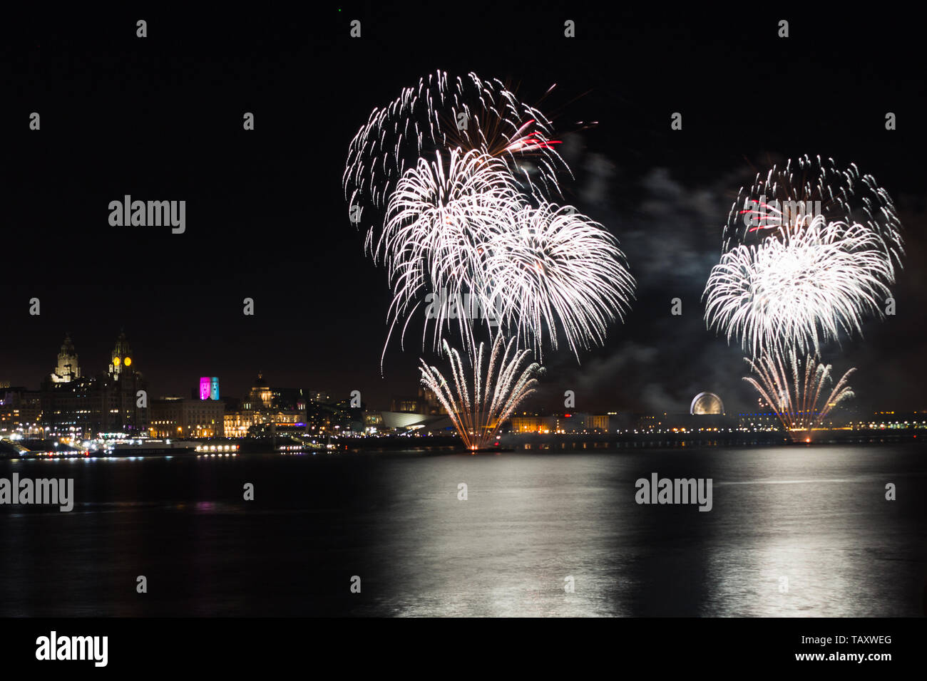 Fireworks over the city of Liverpool seen from the Wirral Stock Photo ...
