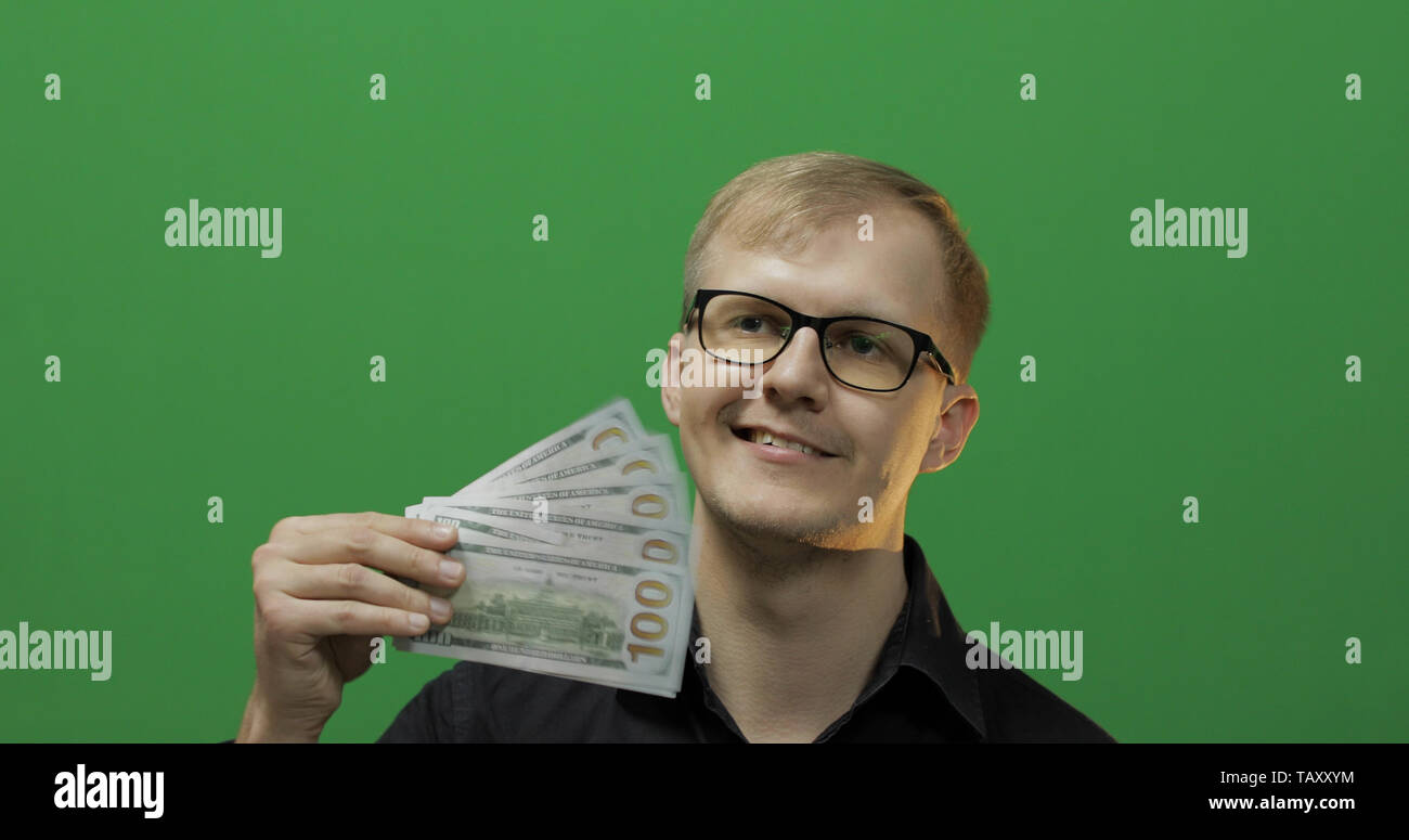 Man received paper money for a major deal. Happy. Get money cash ...