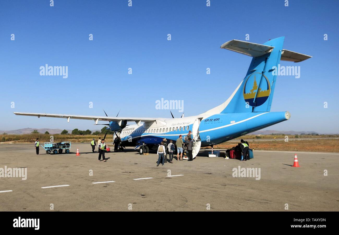 MANDALAY, MYANMAR - JANUARY 10. 2016: Passengers boarding small ...