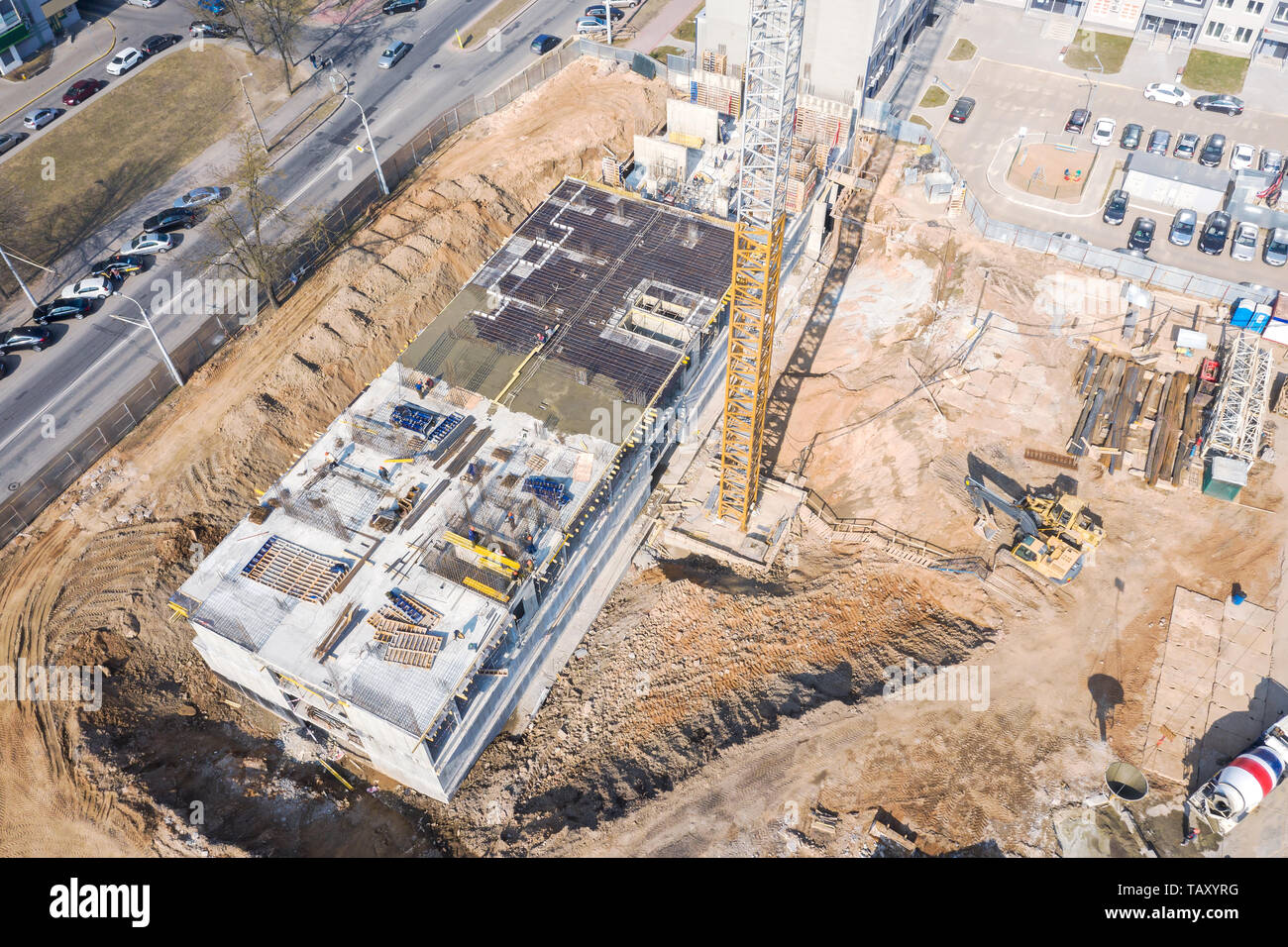 aerial top view of heavy industrial machinery working at city ...
