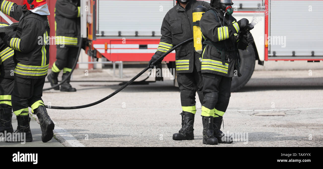 firefighter with apparatus and more people during a fire drill Stock ...