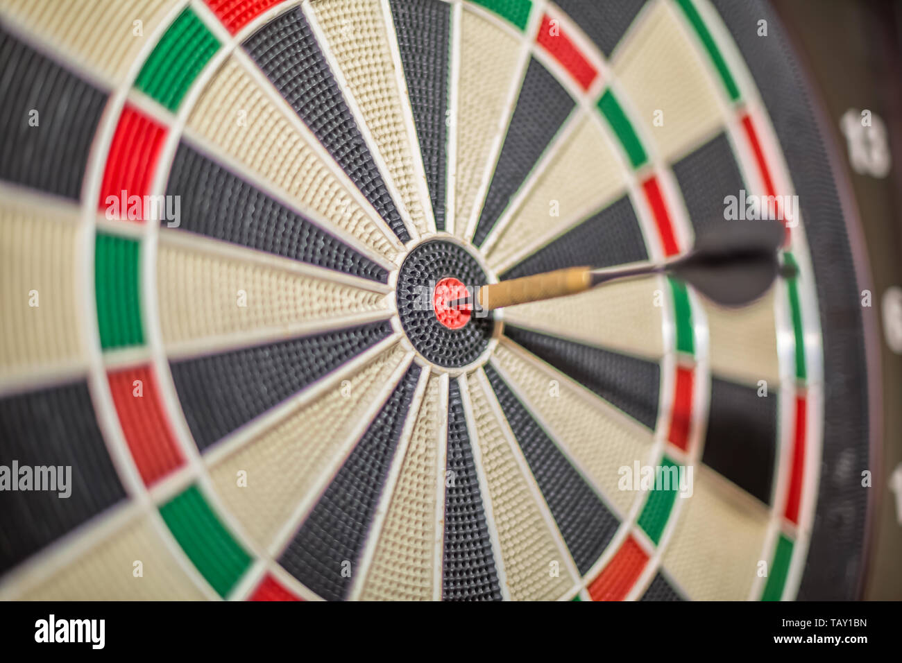 Accurate dart sight hitting center of target, dartboard and dart ...