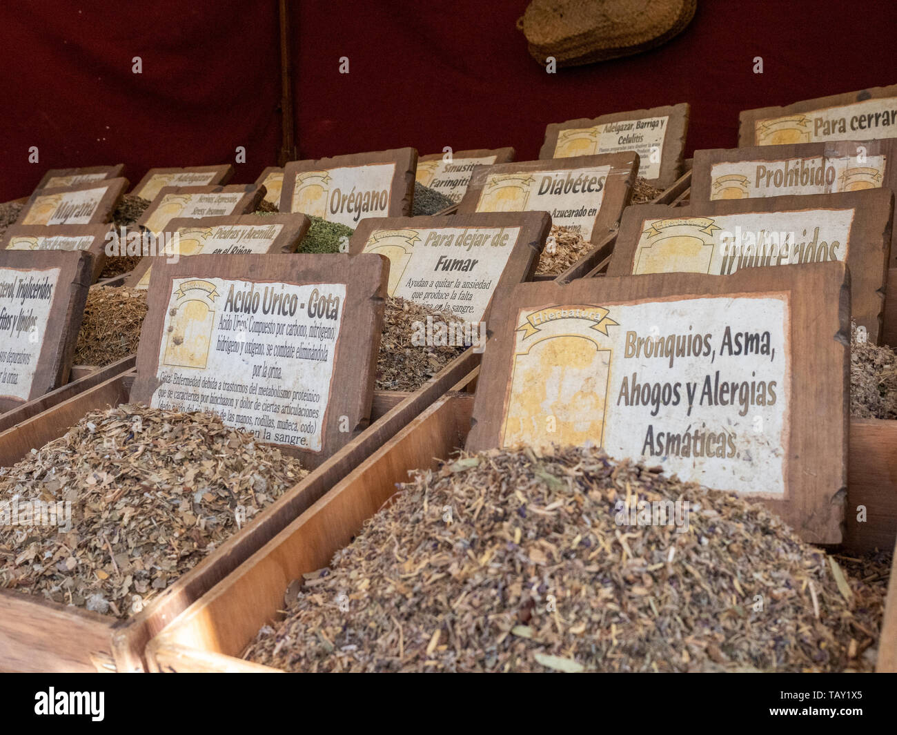 Street stall in a medieval market with food on display for sale to ...
