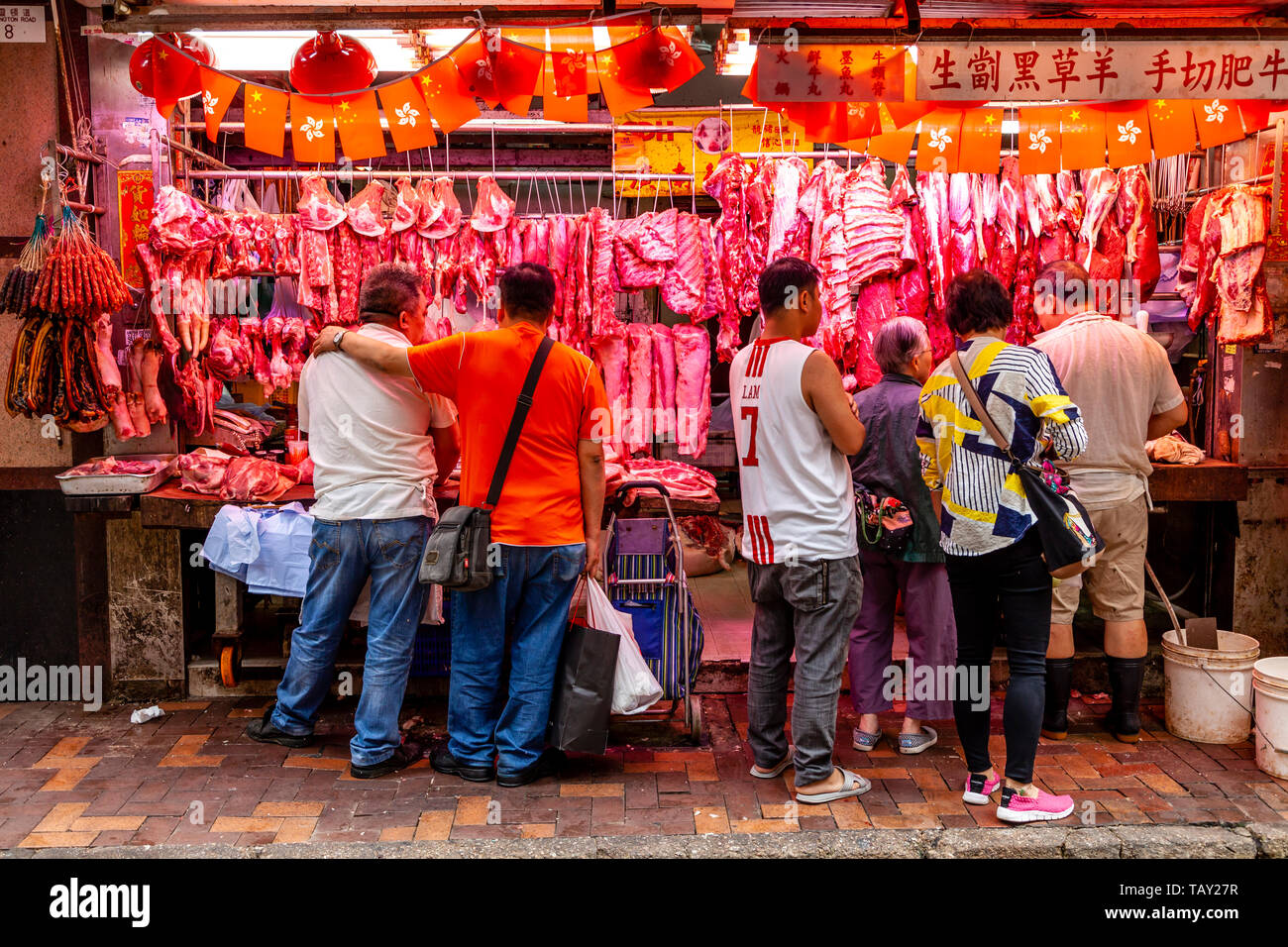 Local People Buying Meat At A Butchers Shop At The Bowrington Road Food ...