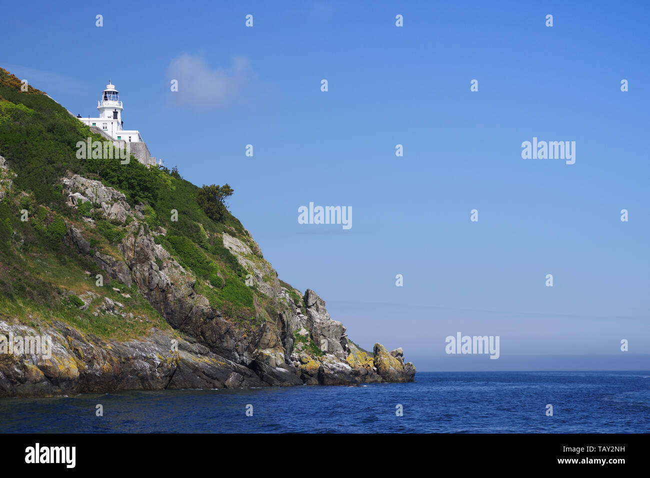 Sark Lighthouse visible on the approach by boat - Sark, Channel Islands ...