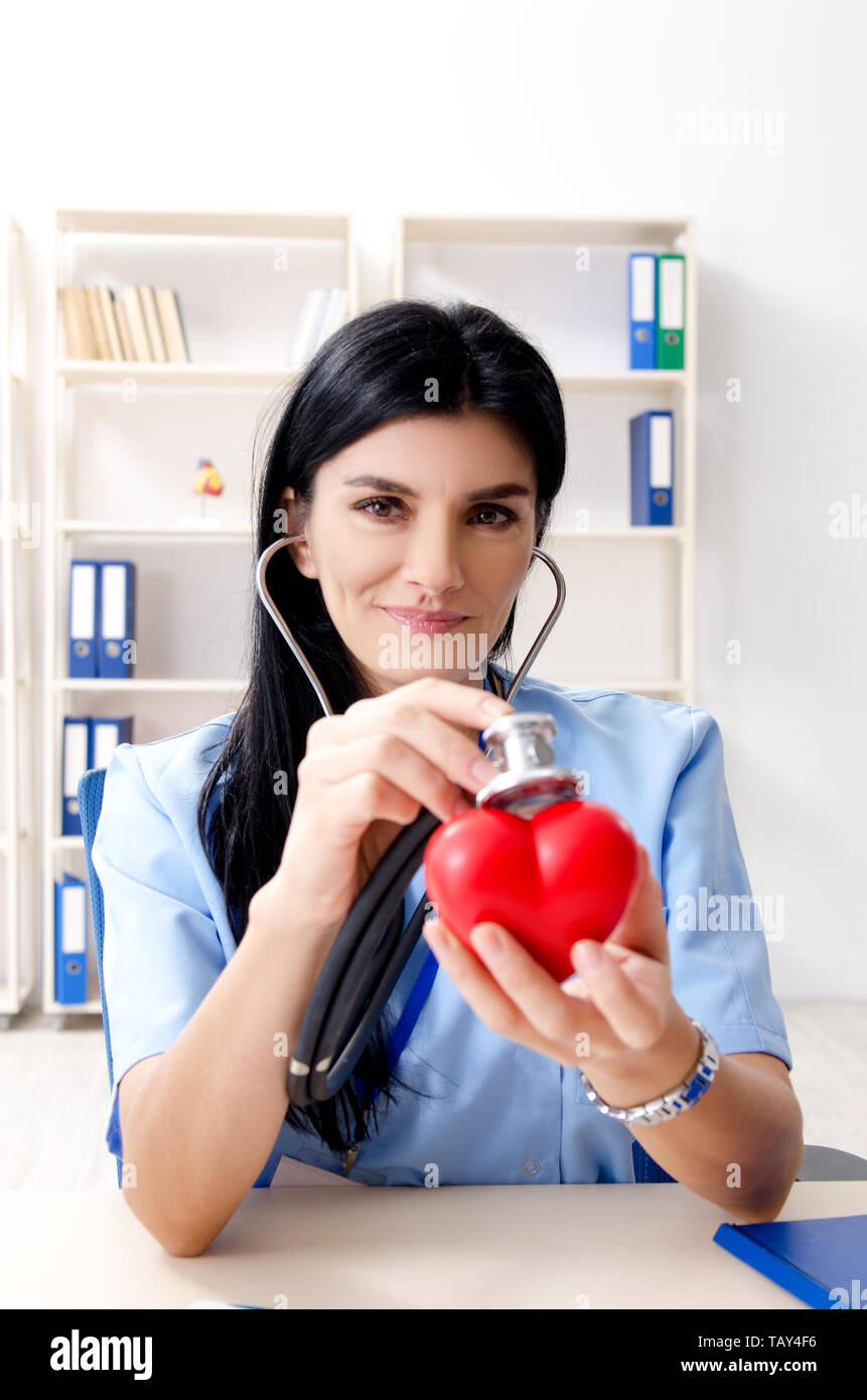 Female doctor cardiologist working in the clinic Stock Photo - Alamy