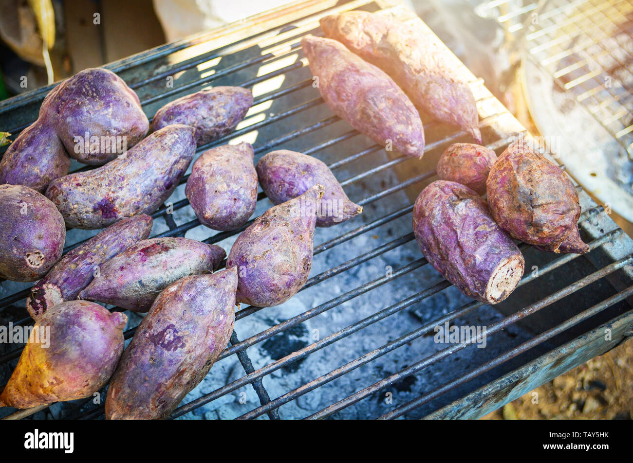 Grilled purple yam - sweet potato on grill Stock Photo - Alamy