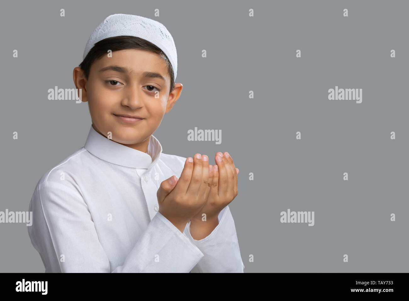 Muslim boy with cap hi-res stock photography and images - Alamy