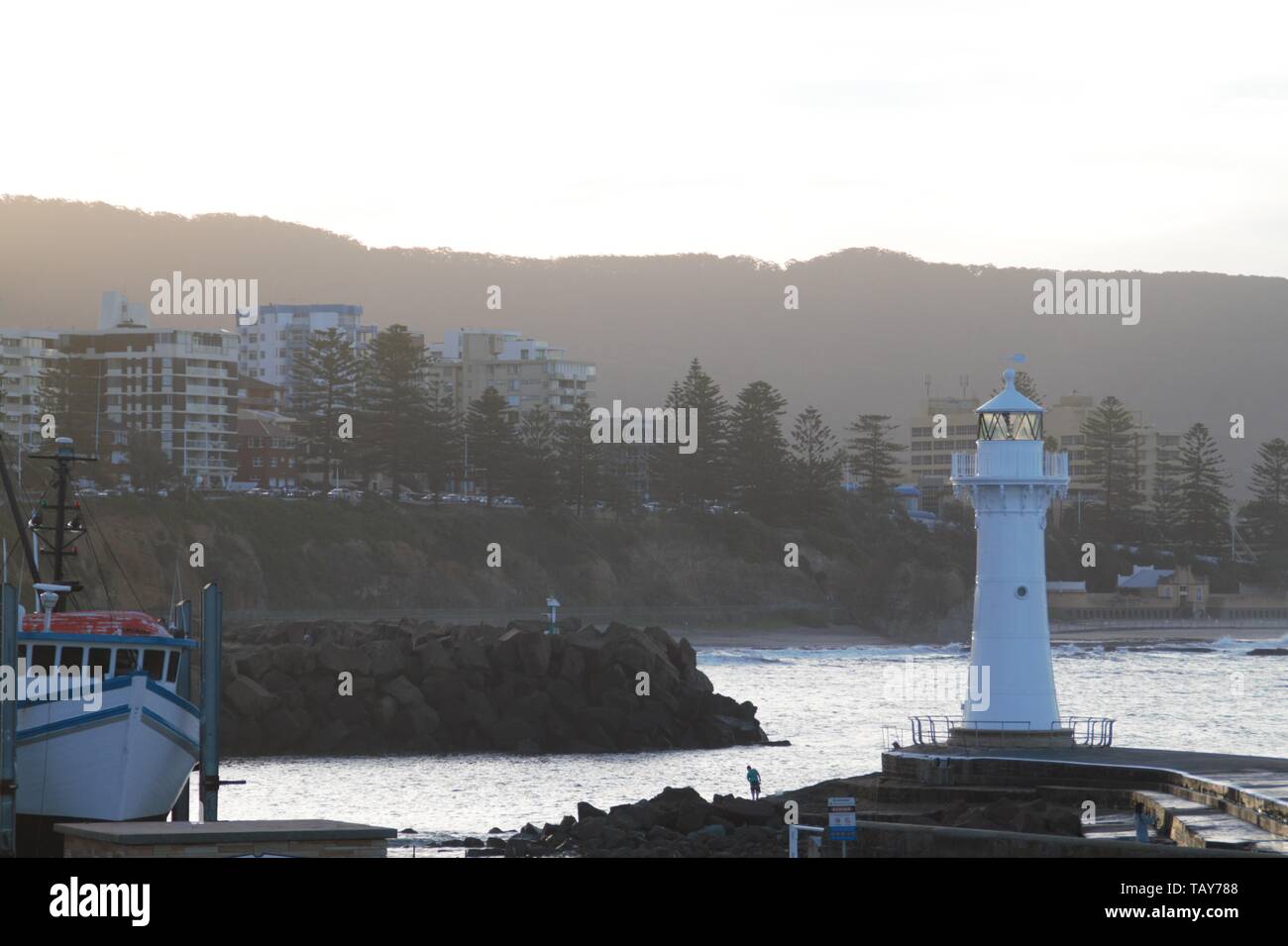 Romantic lighthouse with a town panorama in Australia Stock Photo - Alamy