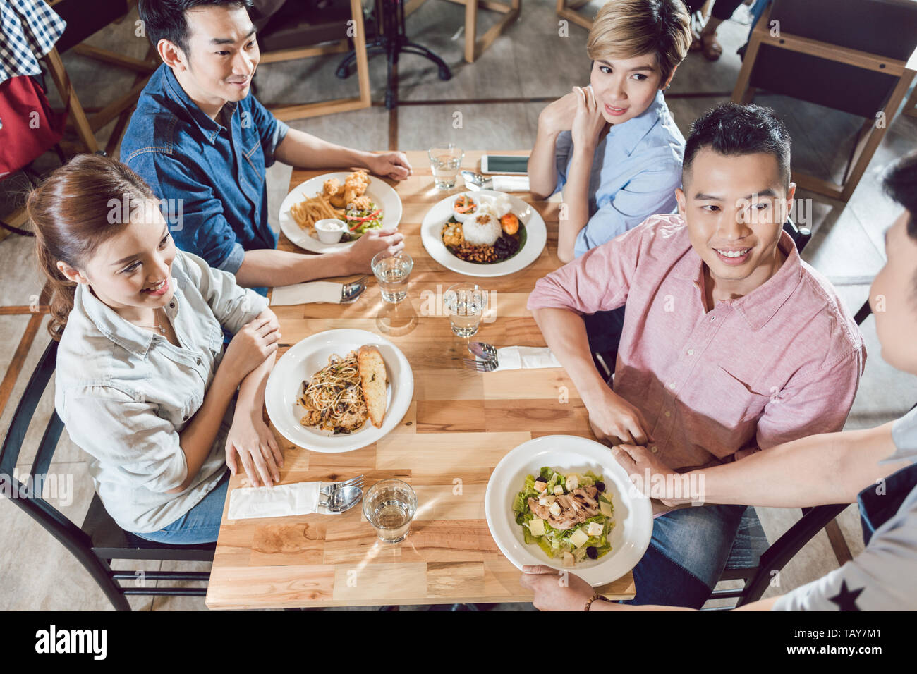 Top view of waiter serving food in restaurant Stock Photo - Alamy