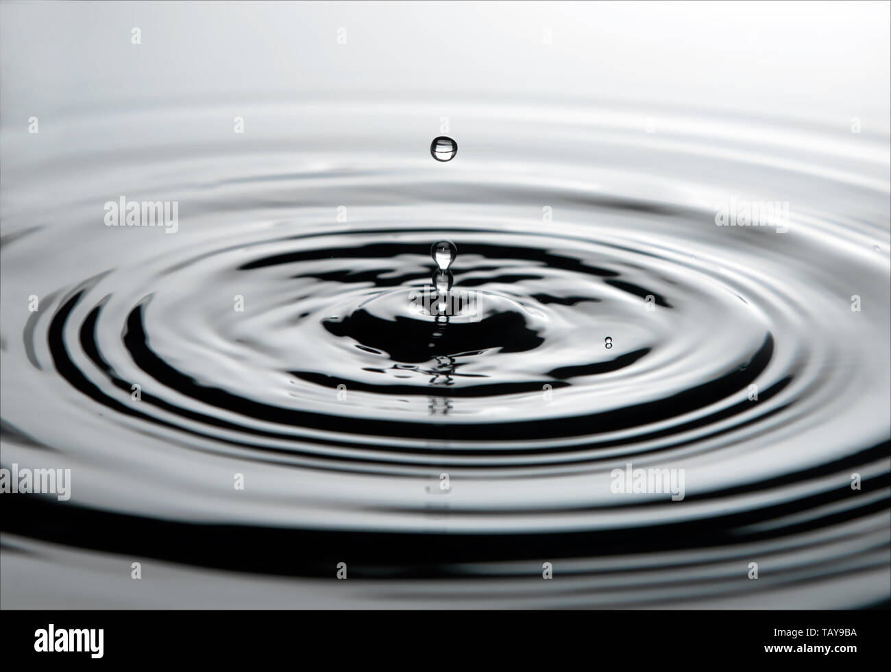 Water drop background with symmetrical reflections Stock Photo - Alamy