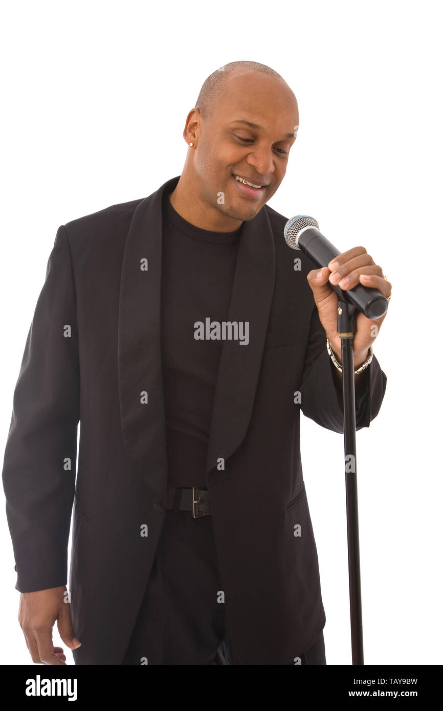 Handsome african american singer with microphone on white Stock Photo ...