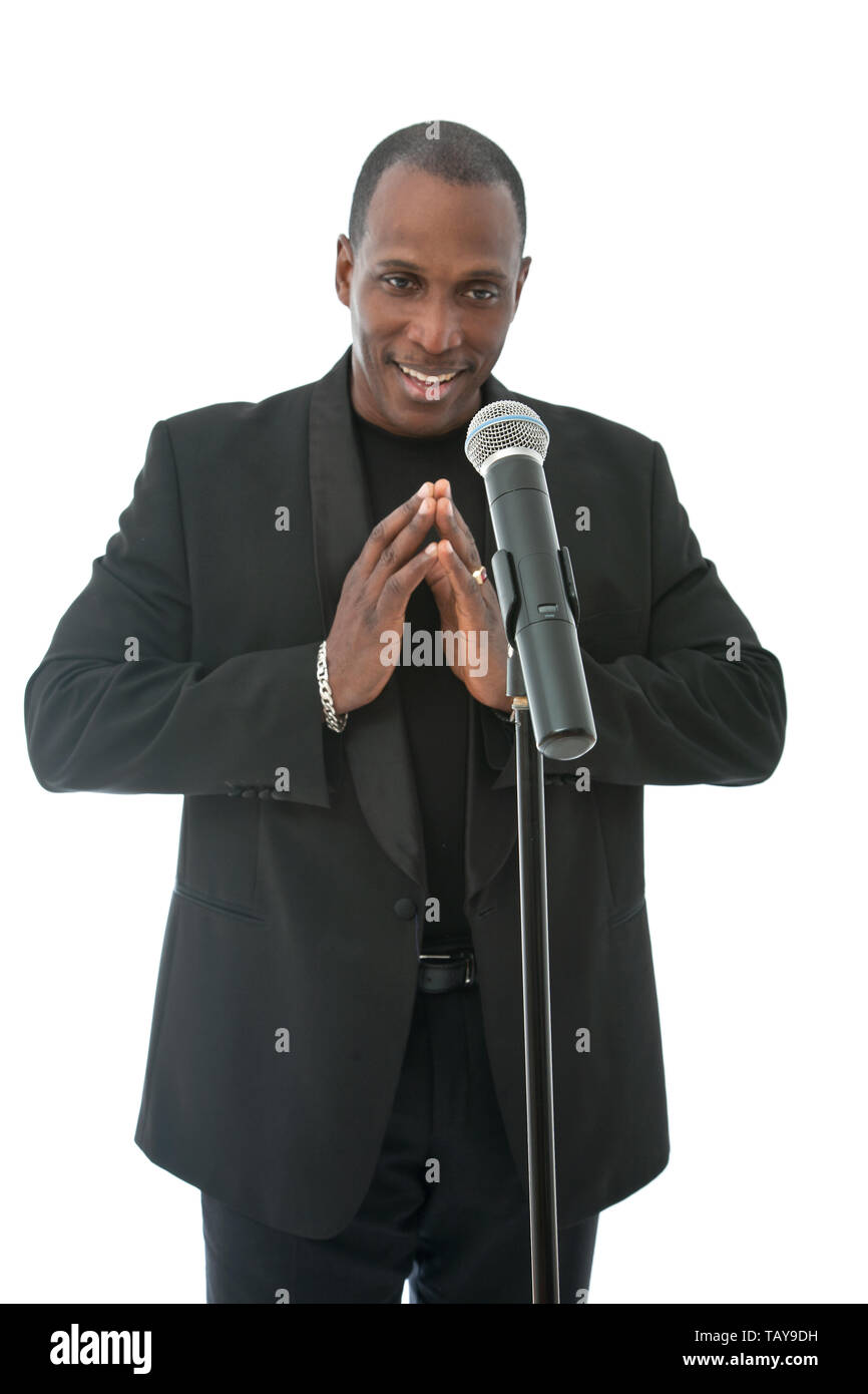 African American singer standing on a white background Stock Photo - Alamy