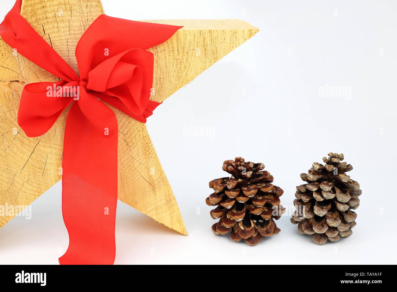 Christmas star decoration with red bow Stock Photo - Alamy