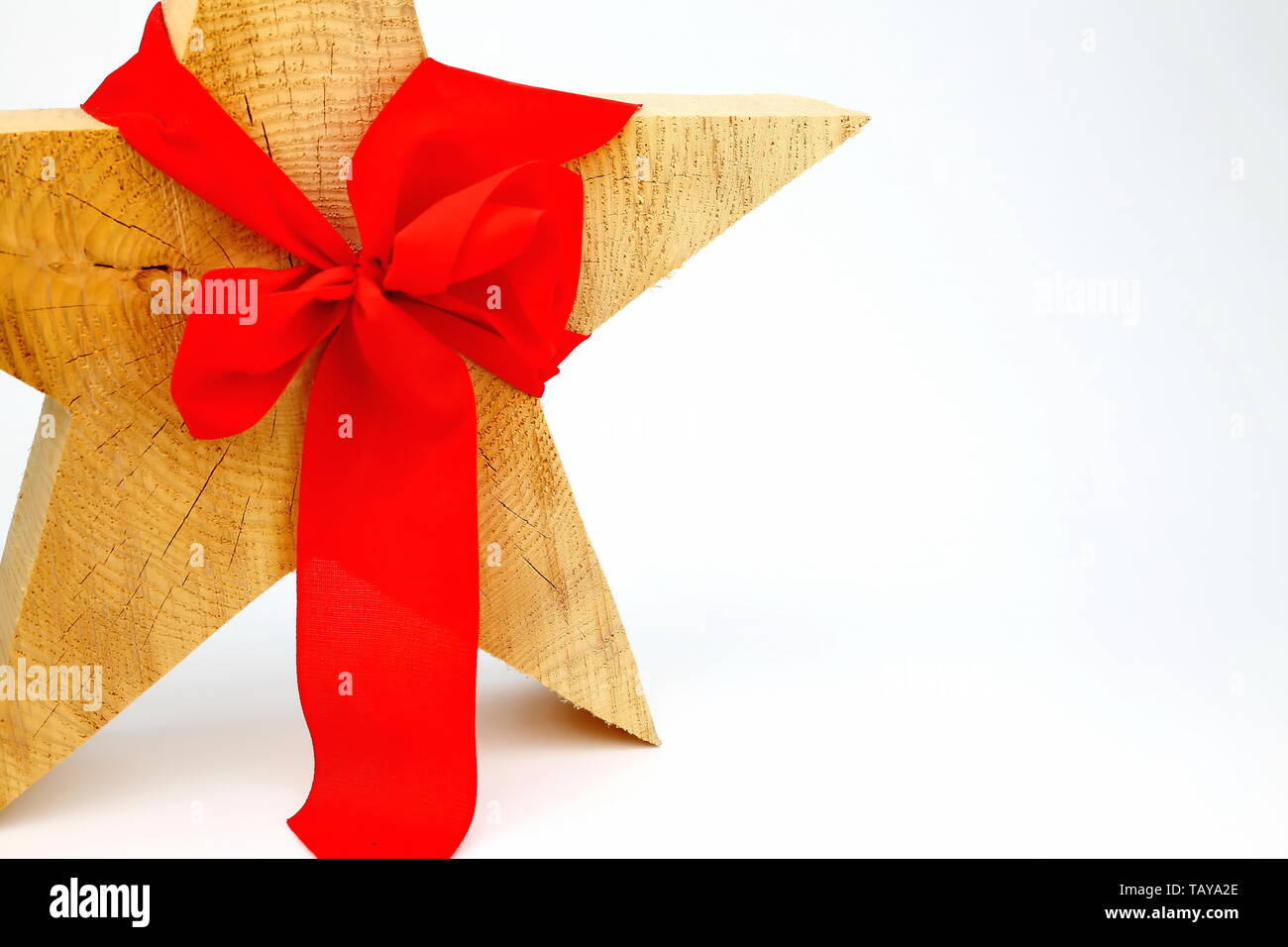 Christmas star decoration with red bow Stock Photo - Alamy