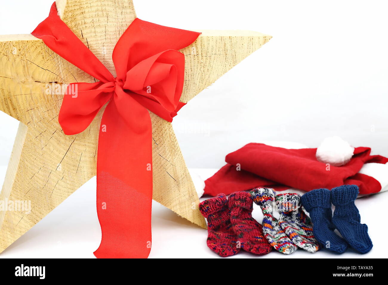 Christmas star decoration with red bow Stock Photo - Alamy