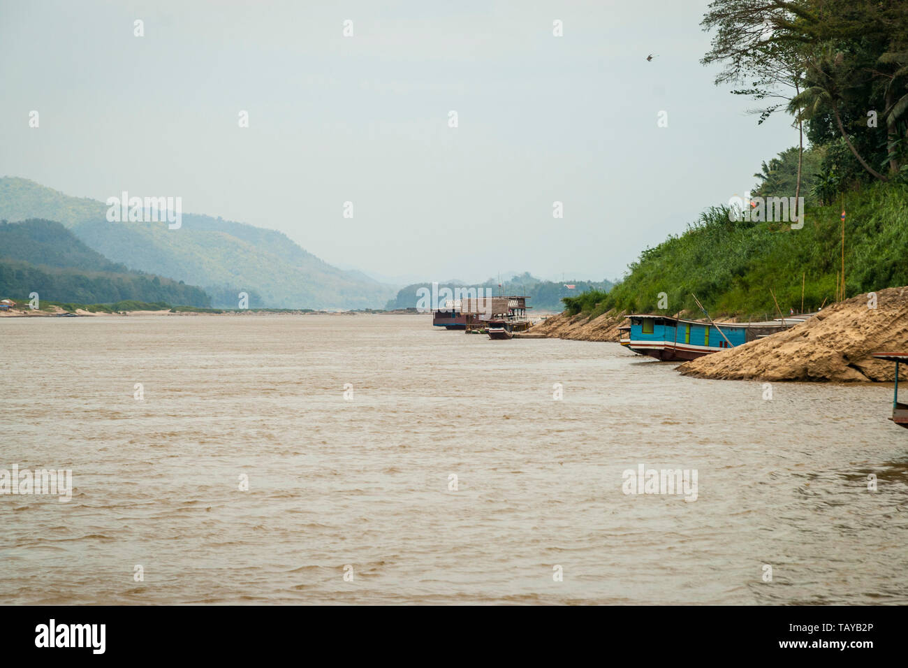 Long boats by the Mekong river, Laos Stock Photo - Alamy