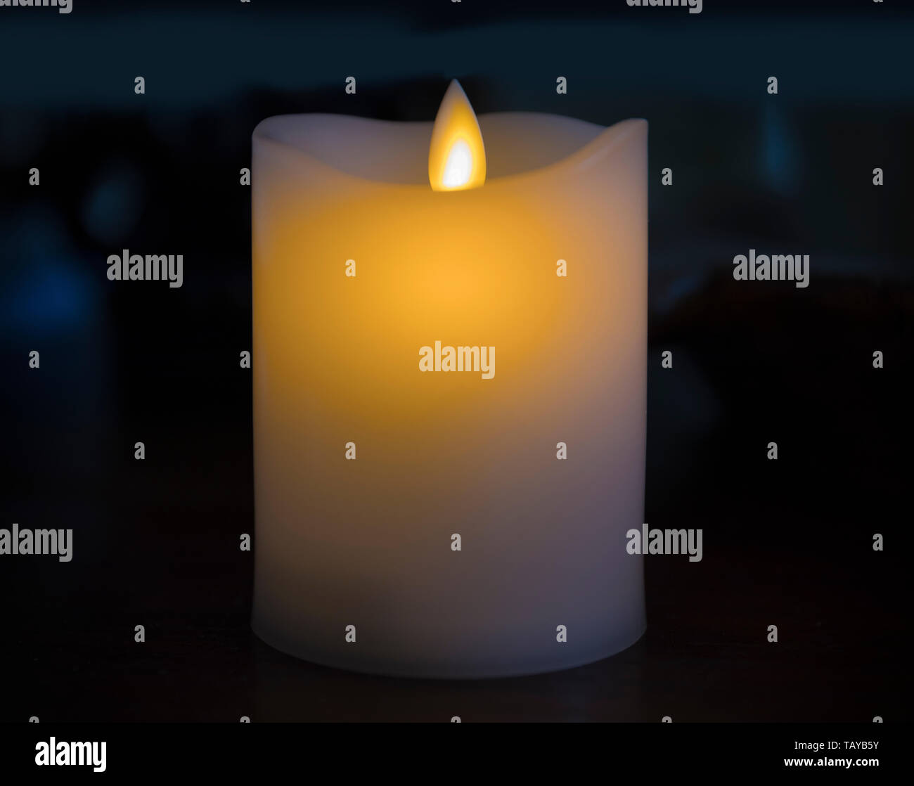 single candle lit in a black background. Stock Image Stock Photo - Alamy