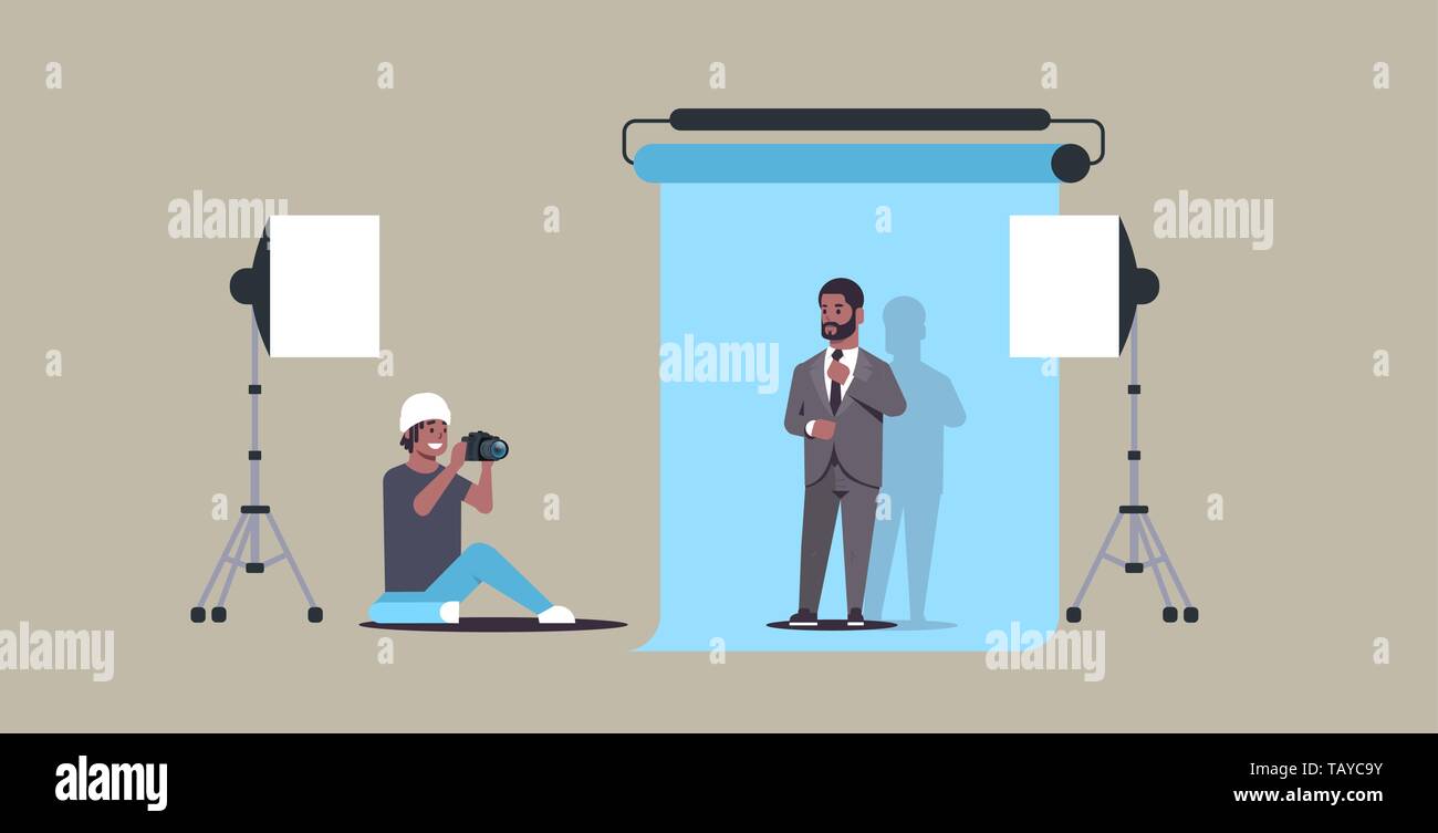 professional photographer using camera shooting business man in formal ...