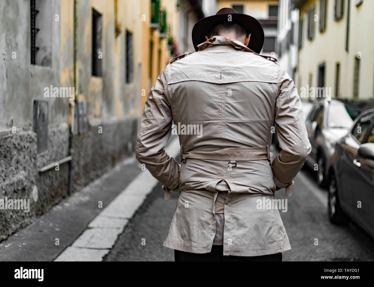 Detective walking in the city slums Stock Photo - Alamy