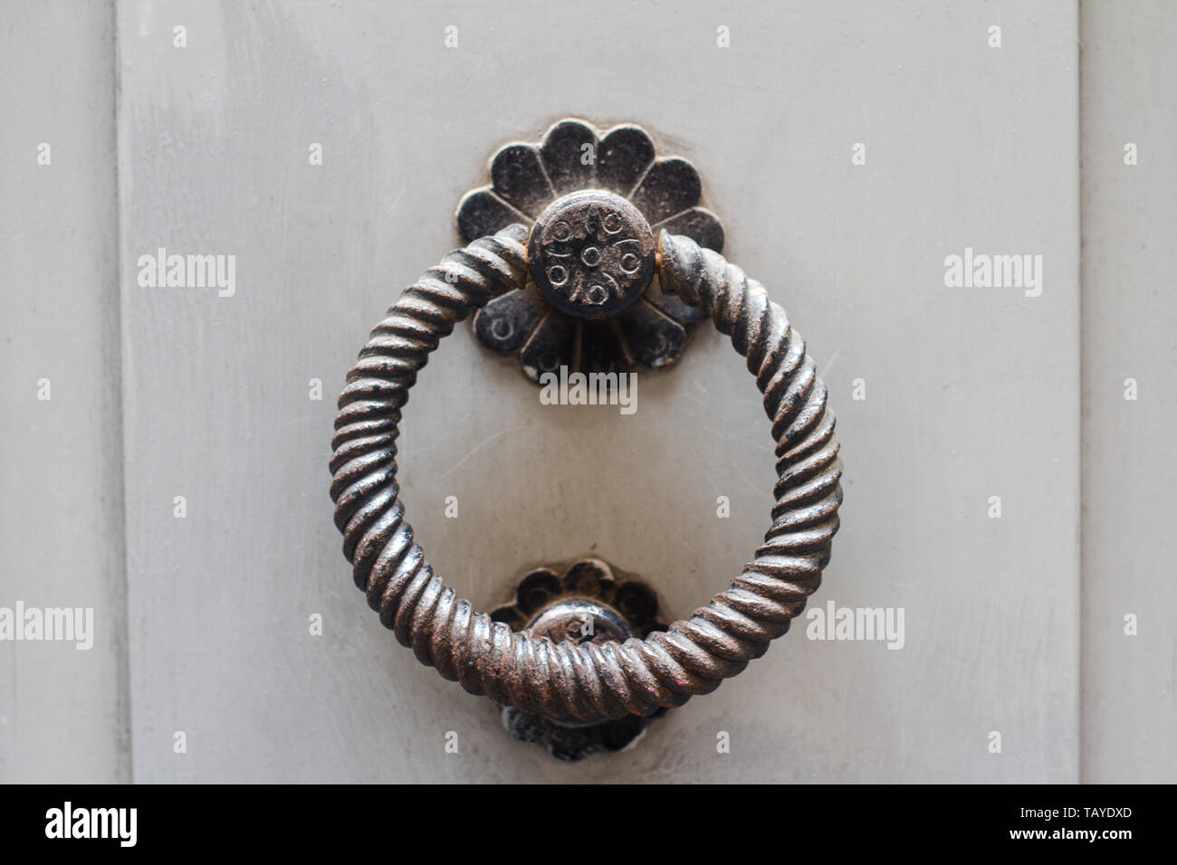 horizontal front view closeup on vintage rusted metallic door knob with ...