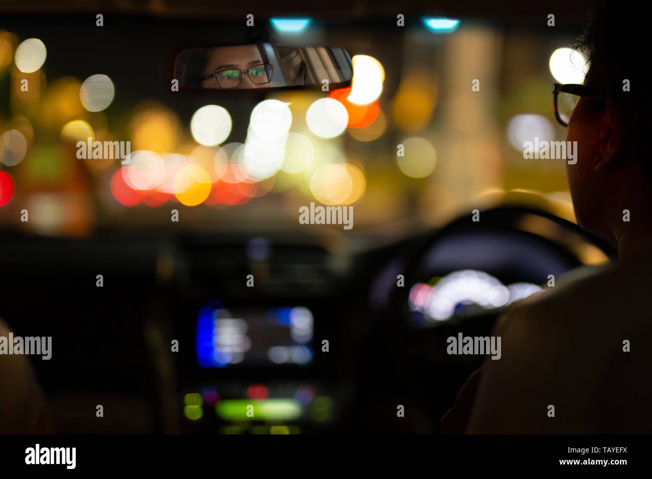 Woman driving car night time hi-res stock photography and images - Alamy