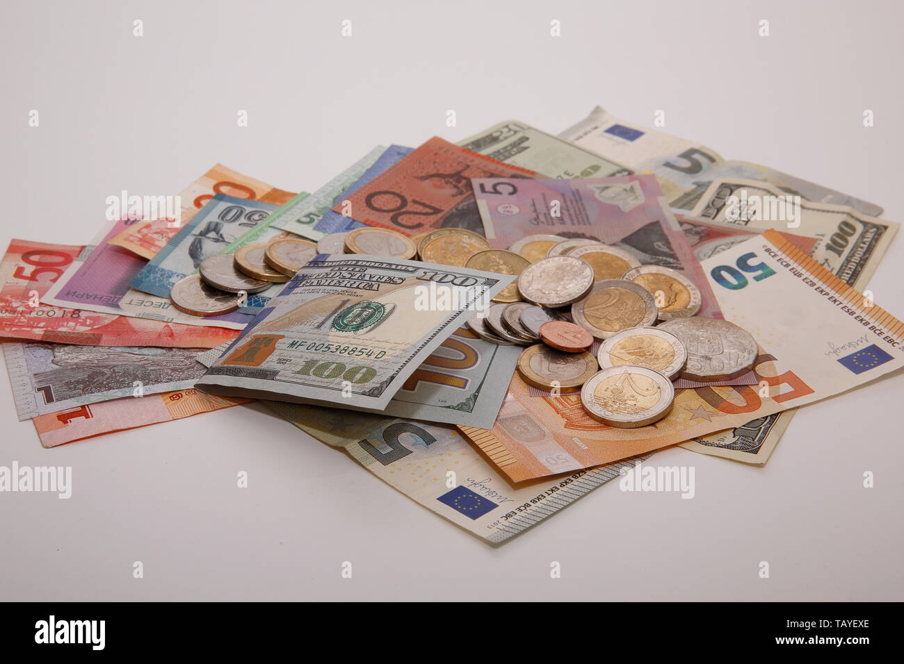 A composition with various country banknotes and coins Stock Photo - Alamy