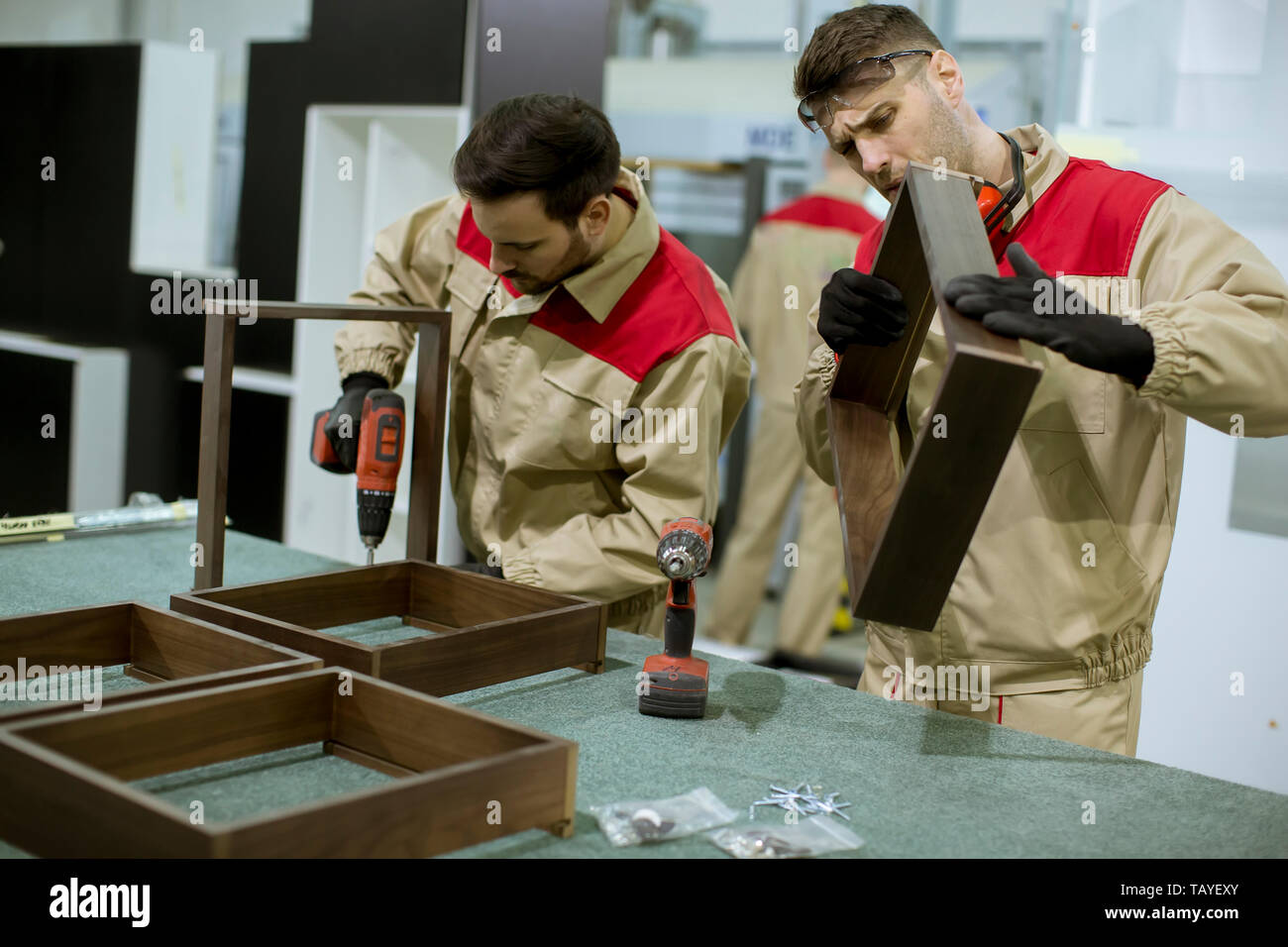 Two handsome young workers hi-res stock photography and images - Alamy