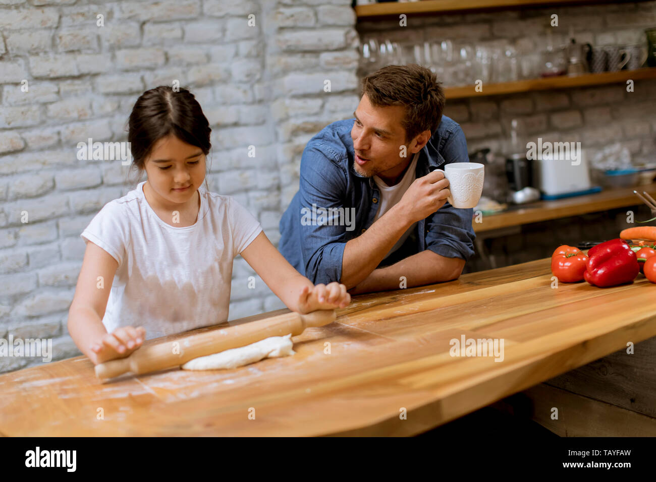 Father and daughter making bread in the rustic kitchen Stock Photo - Alamy