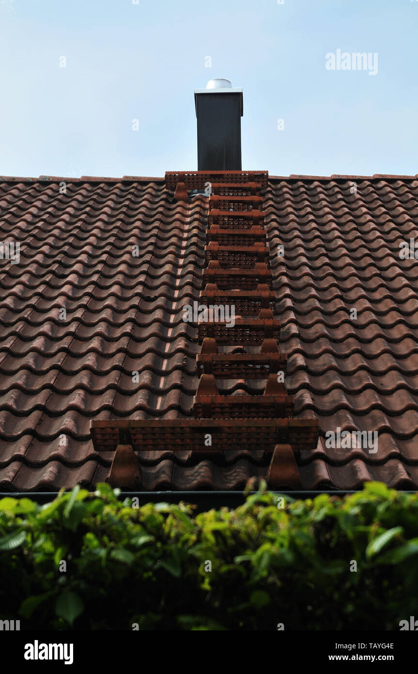 metal steps on a roof leading to chimney, installation for chimney ...