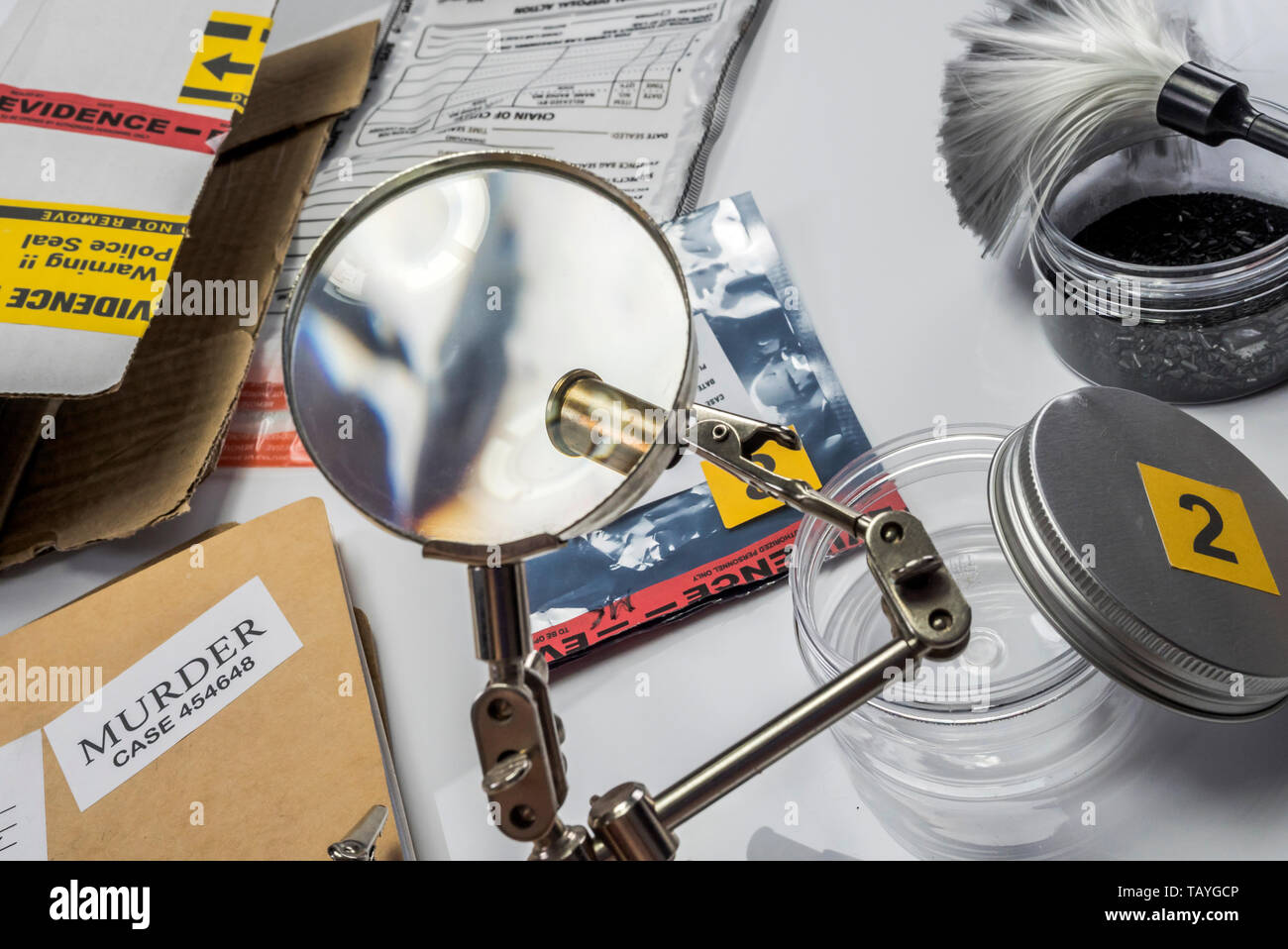 Expert police examines a bullet cap in scientific laboratory with ...