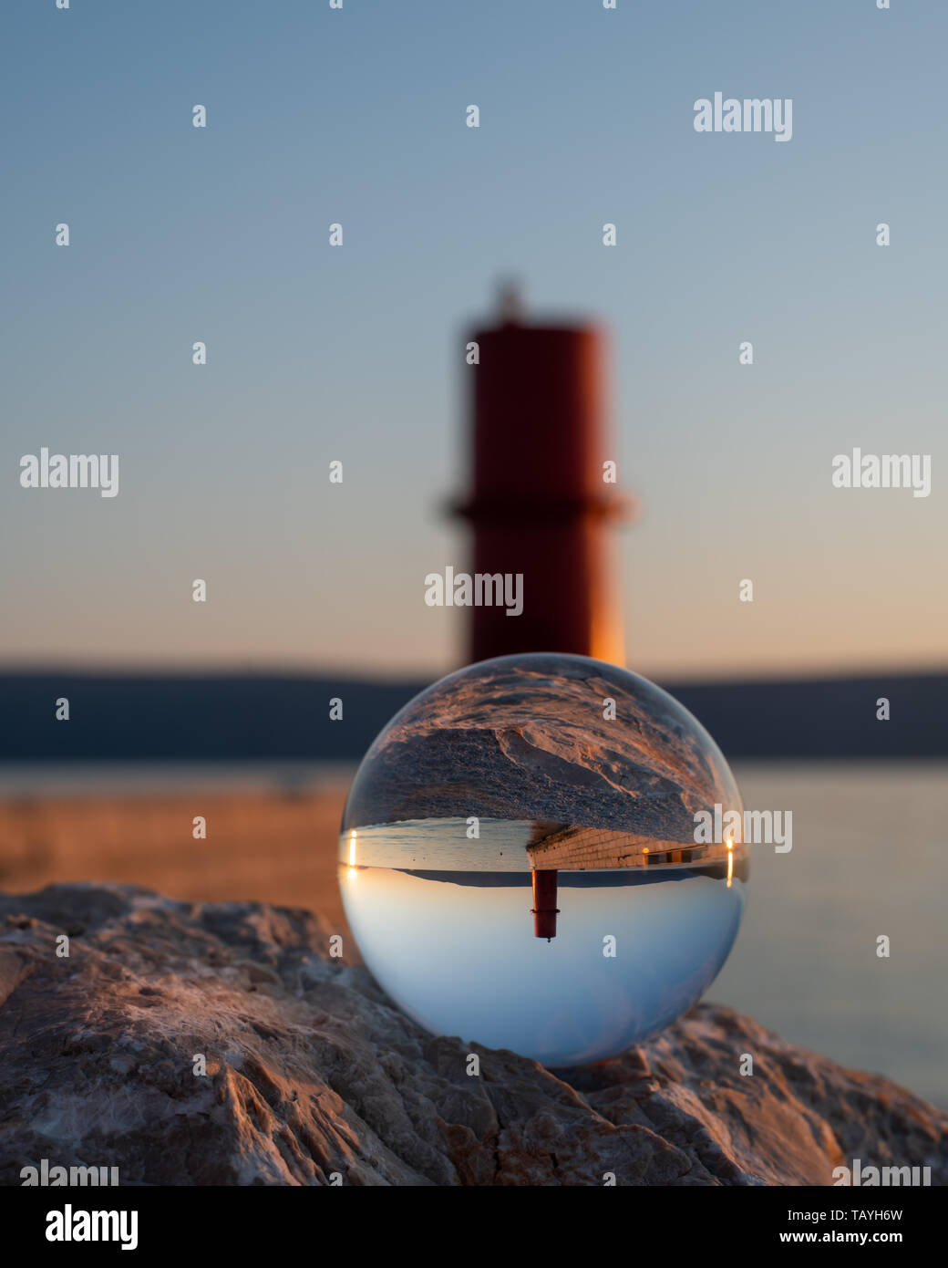 Sunset through glass sphere at the lighthouse of Cres (Croatia Stock ...