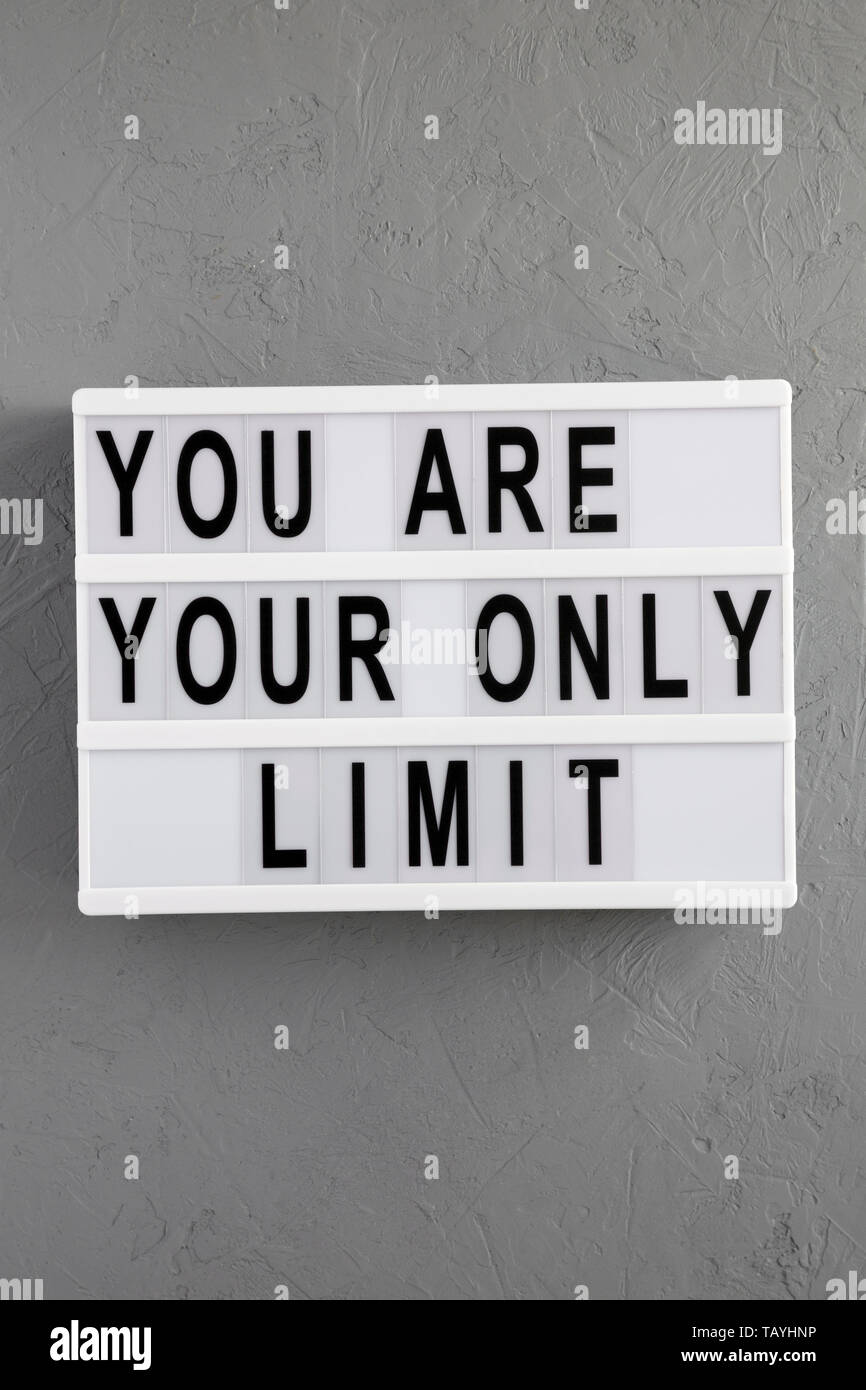 'You are your only limit' words on a modern board over concrete ...