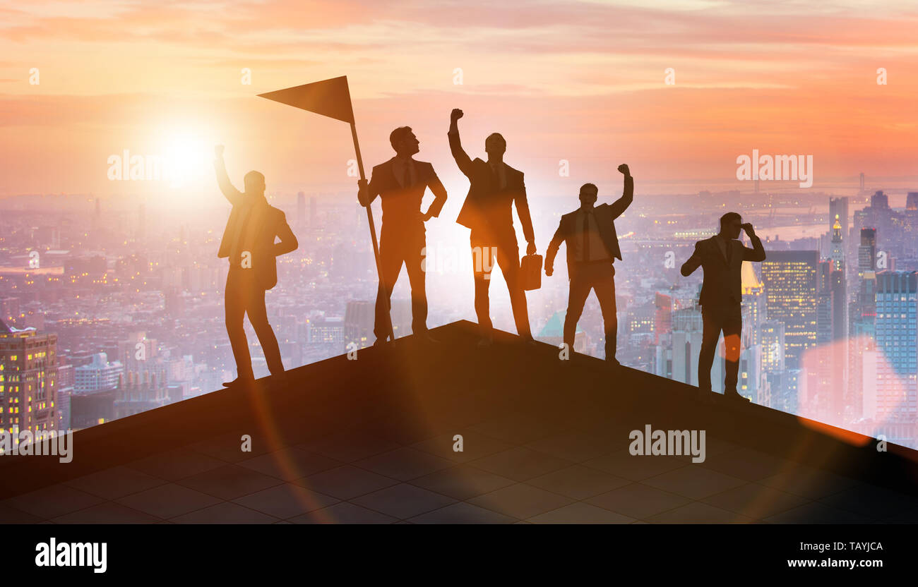 Businessmen in achievement and teamwork concept Stock Photo - Alamy