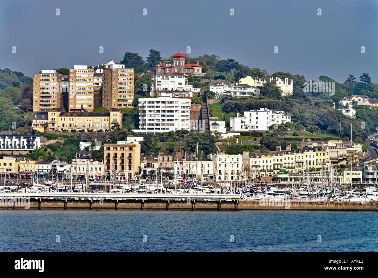 The town centre of Torquay as seen from across the bay on a summers ...