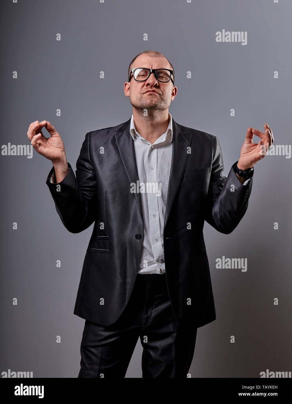 Fun comic bald business man in black fashion eyeglasses practicing the ...