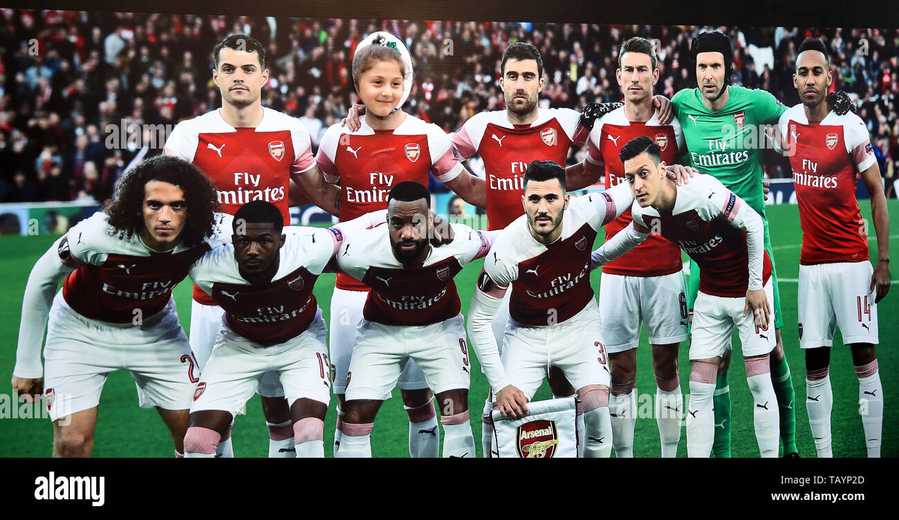 An Arsenal fan poses as part of the team in a picture in the Fan Zone ...
