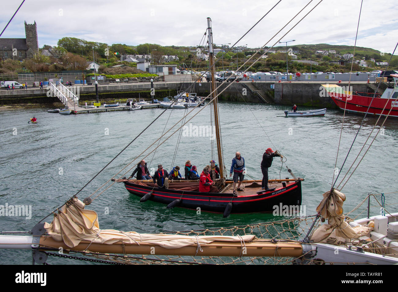 traditional wooden sailing ship coming alongside a pier Stock Photo - Alamy