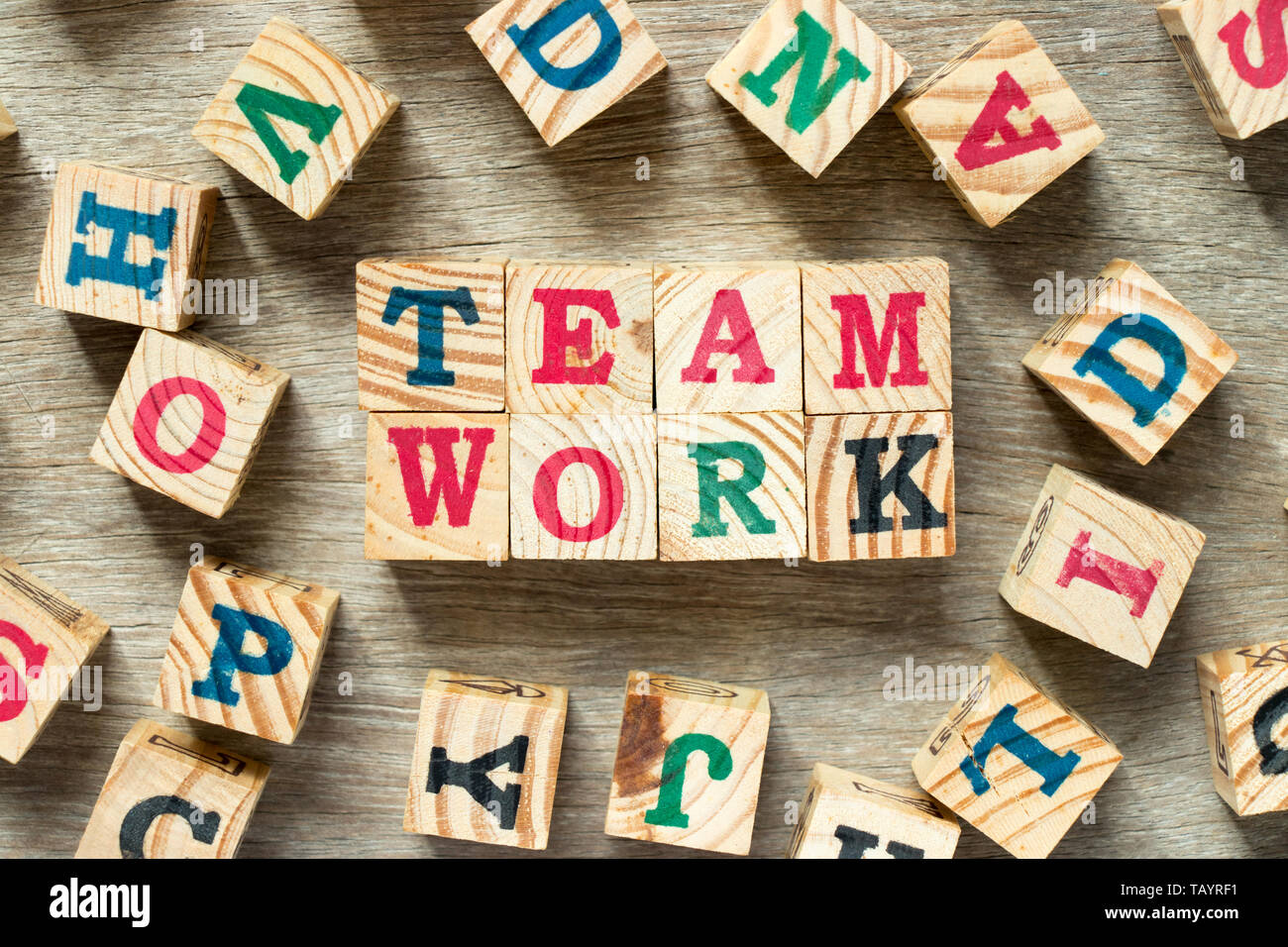 Letter block in word with another on wood background Stock Photo - Alamy