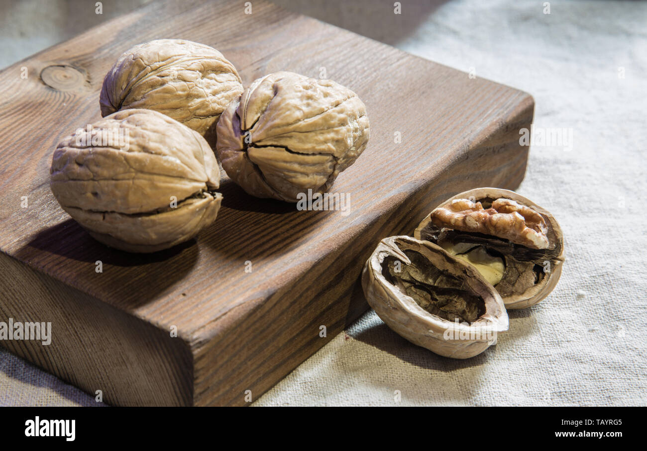 walnut on the wood table Stock Photo - Alamy