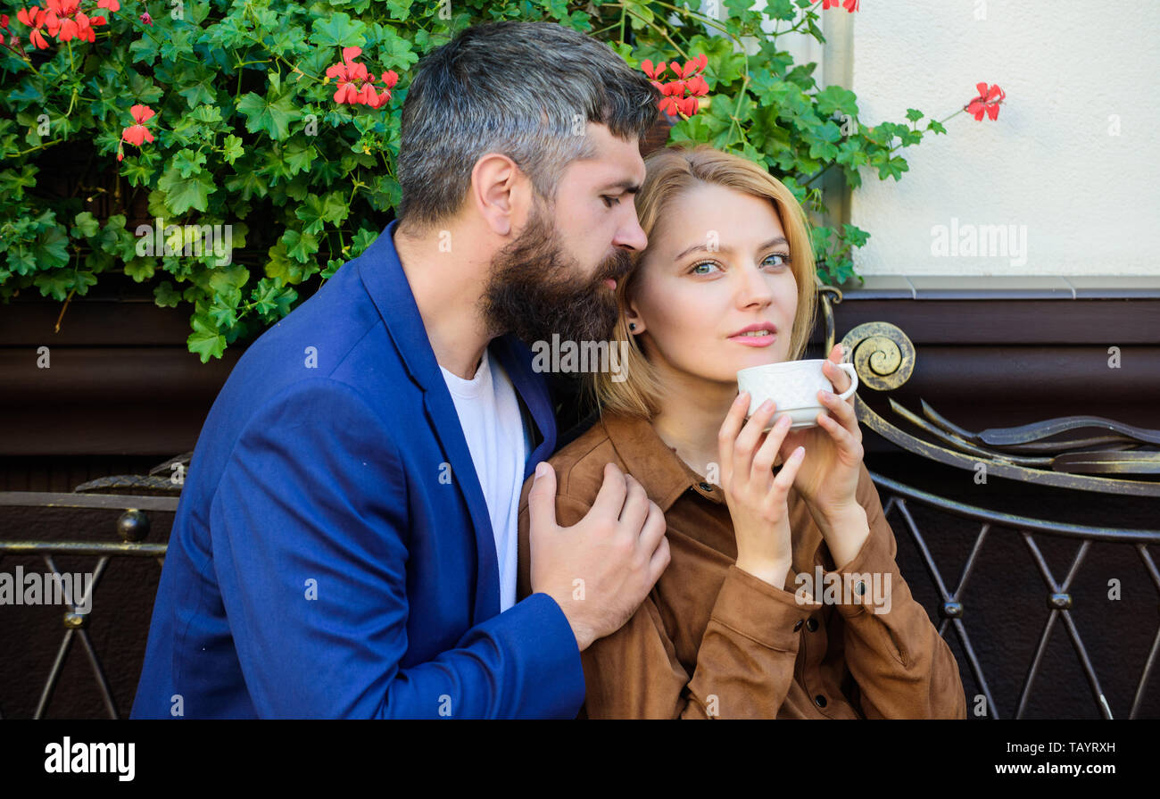 Explore cafe and public places. Couple cuddling cafe terrace. Couple in ...