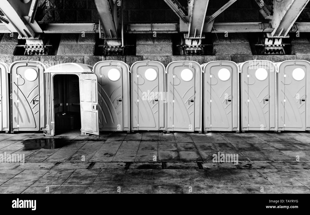 Row public toilets Black and White Stock Photos & Images - Alamy
