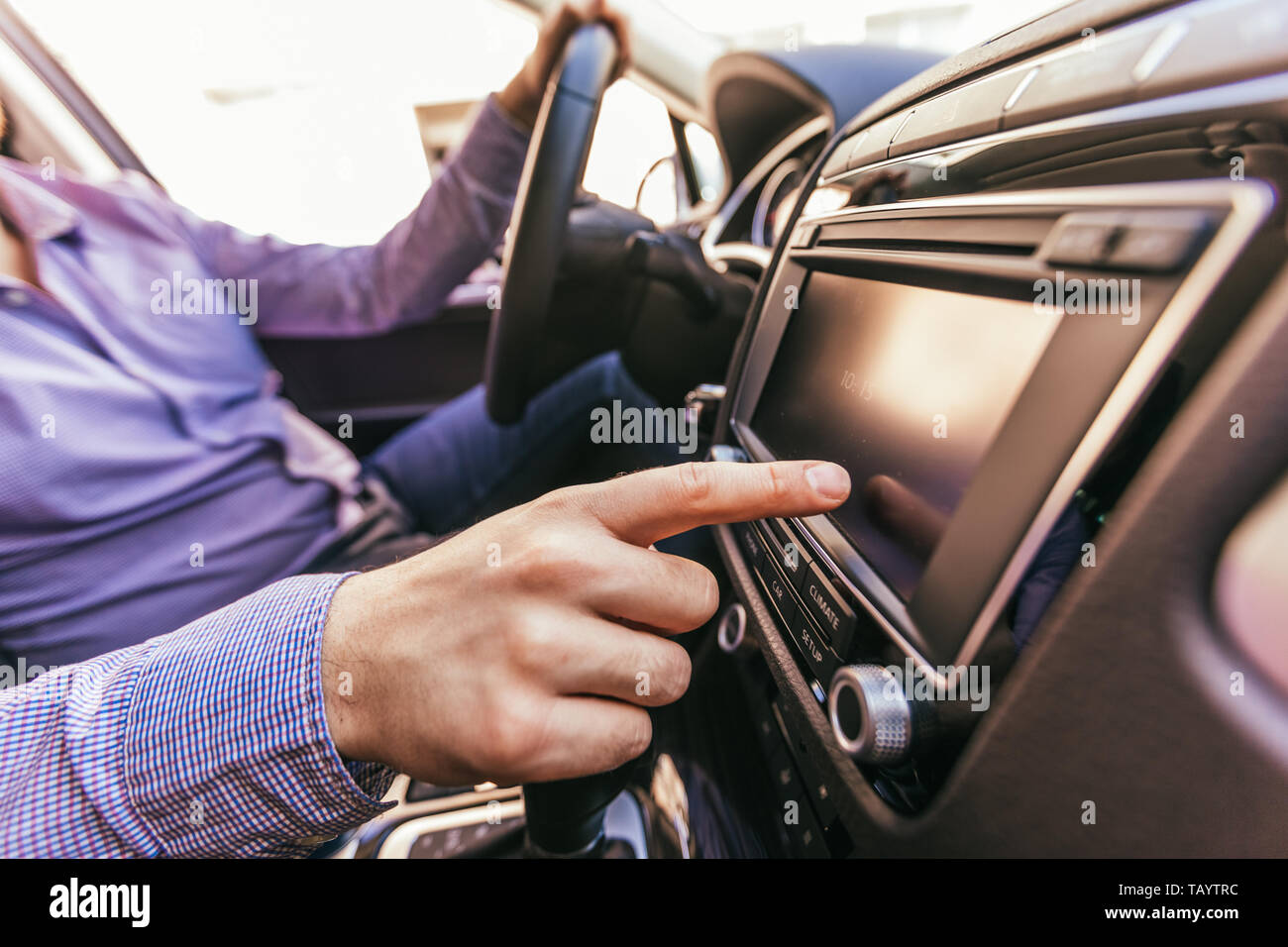 Close-up of a male hand in a modern car Stock Photo - Alamy