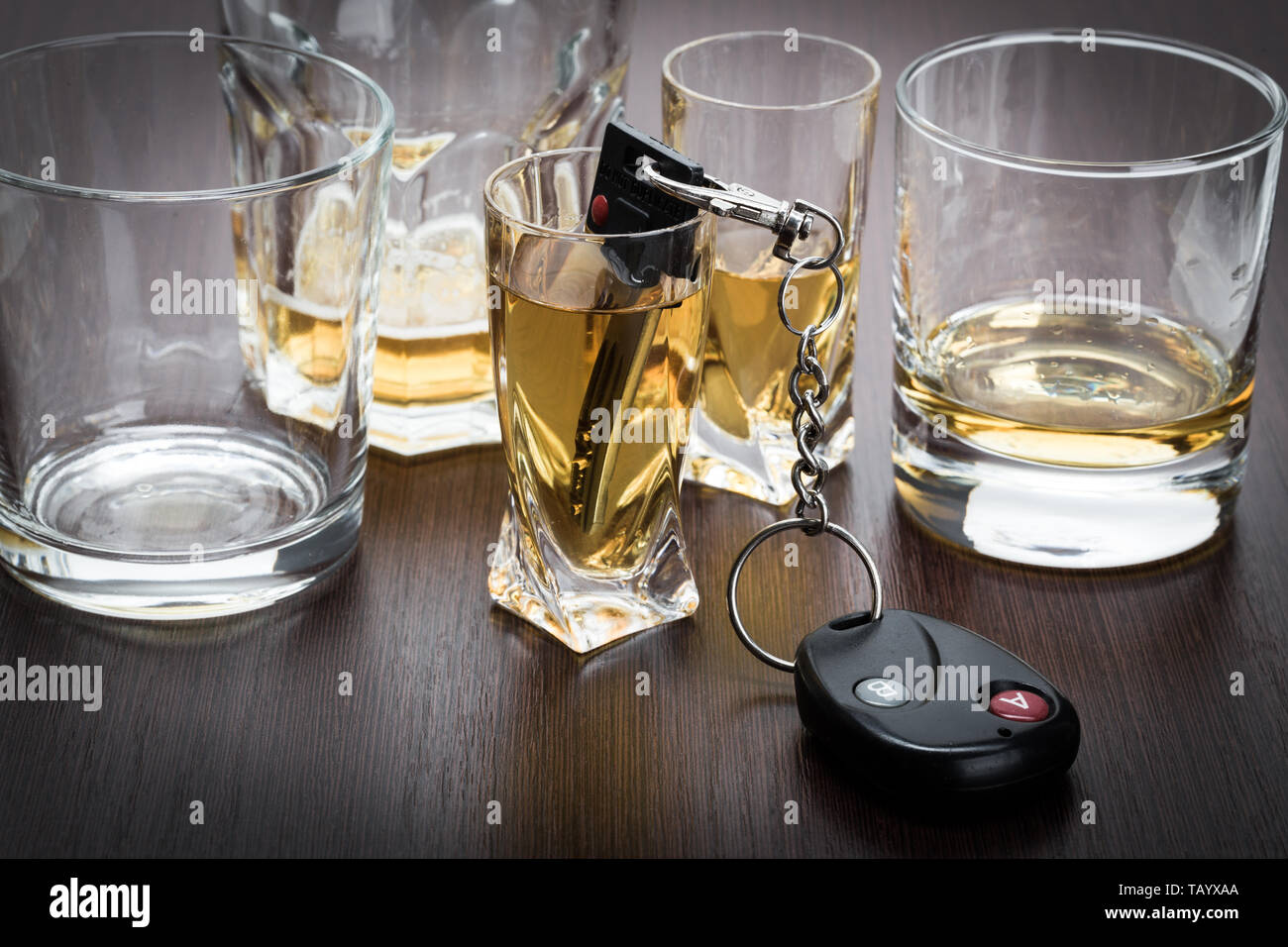 Car key on the bar with spilled alcohol Stock Photo - Alamy