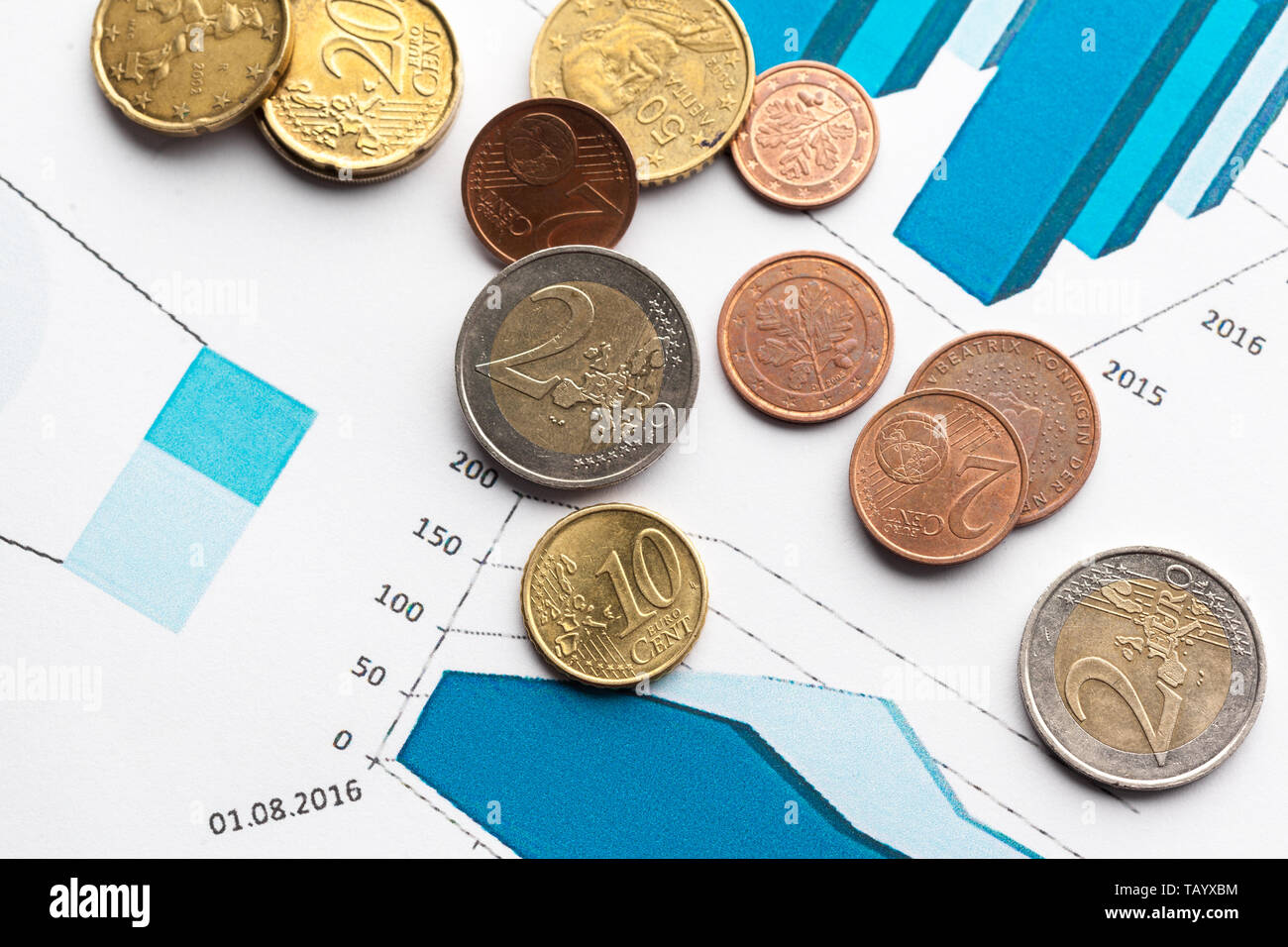 Graph Of Stock Market With Stacks Of Coins Stock Photo - Alamy