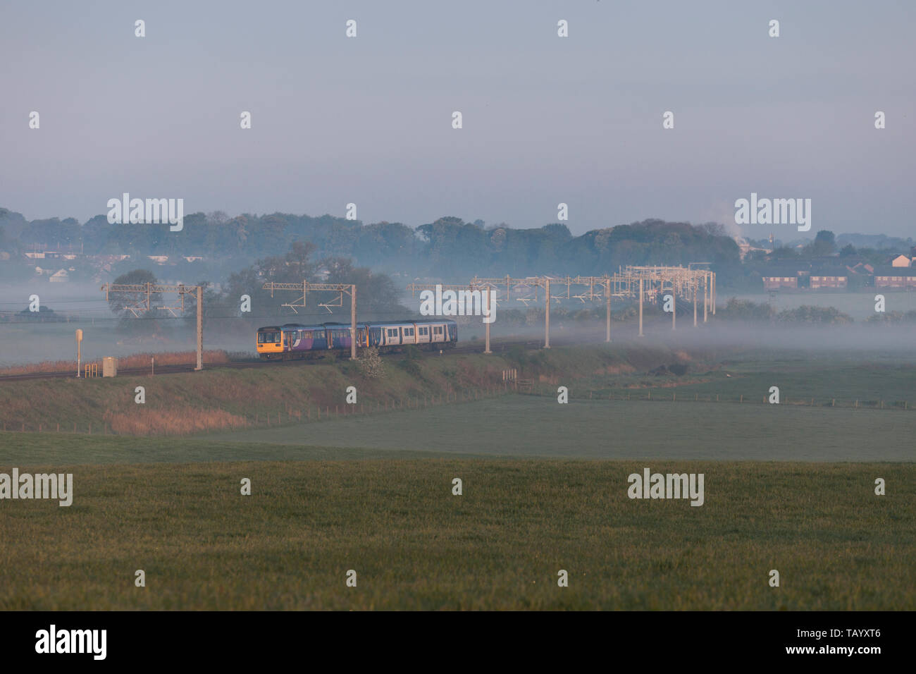 Arriva northern rail class 142 pacer 142054 + class 150 sprinter 150149 at a misty Kirkham and ...